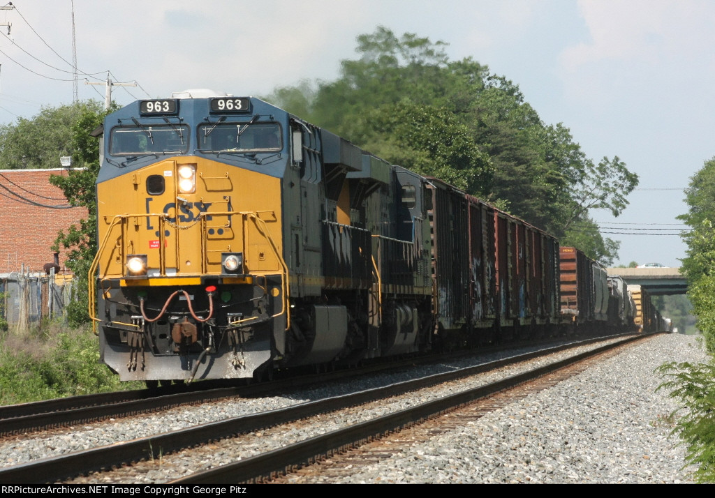 CSX 963 and train Q409